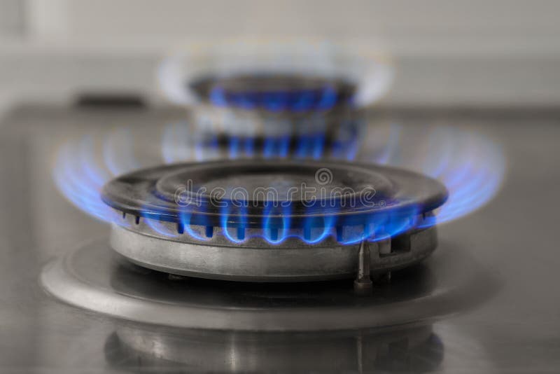 Gas Burner with Burning Flame on Cooktop, Closeup Stock Image - Image ...
