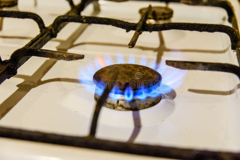 Gas Burner on the White Kitchen Stove Stock Photo - Image of appliance ...