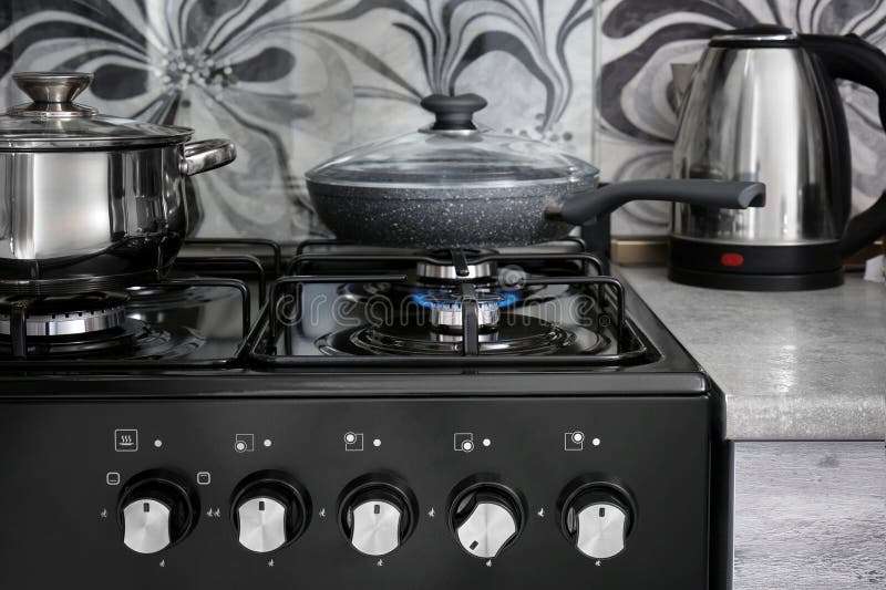 The Gas Burns in the Burner of a Kitchen Stove in Home Kitchen Stock ...