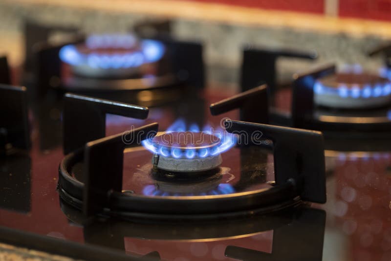 The Gas Burns in the Burner of a Kitchen Stove Stock Photo - Image of ...