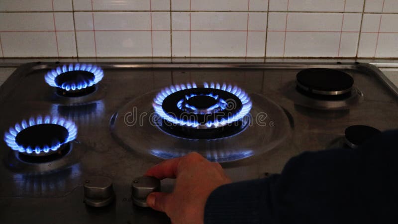 Gas Cooker with Burning Flames of Gas. Domestic Kitchen with Blue ...