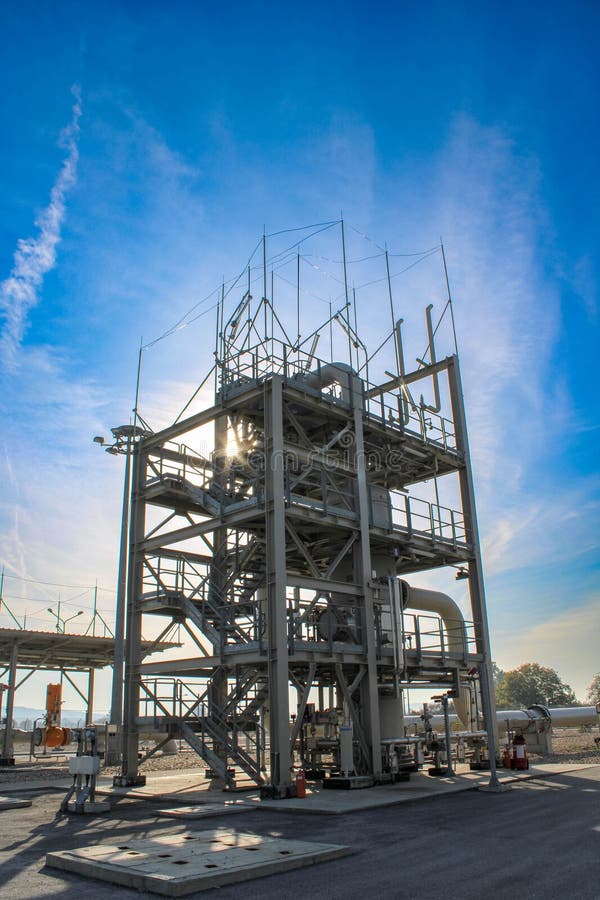 Gas Filter on a Gas Plant, the Blue Sky in the Backdrop, and the Sun ...
