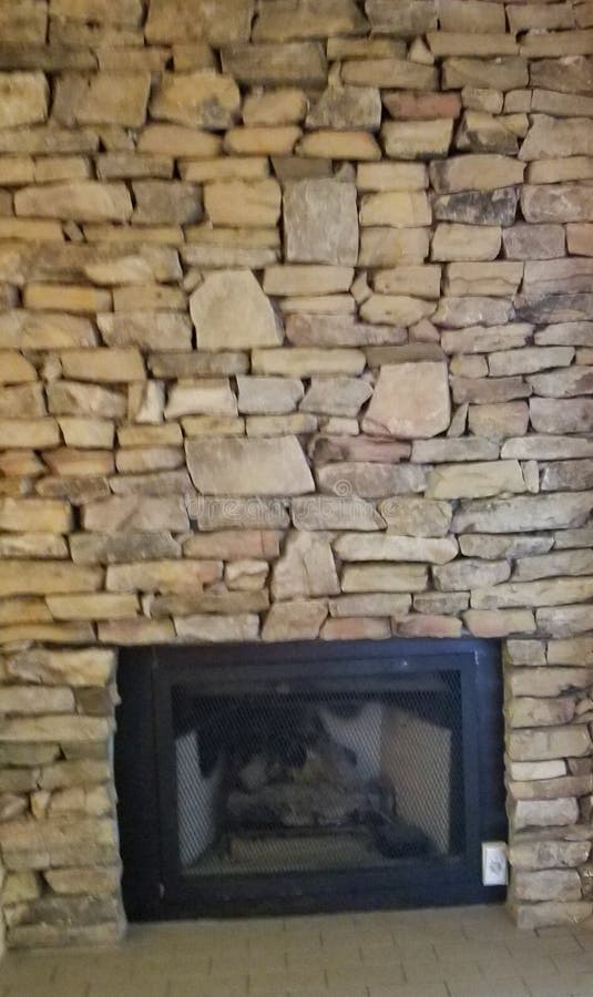 Natural Gas Insert Fireplace With Stone And Wood Stock Image - Image of ...