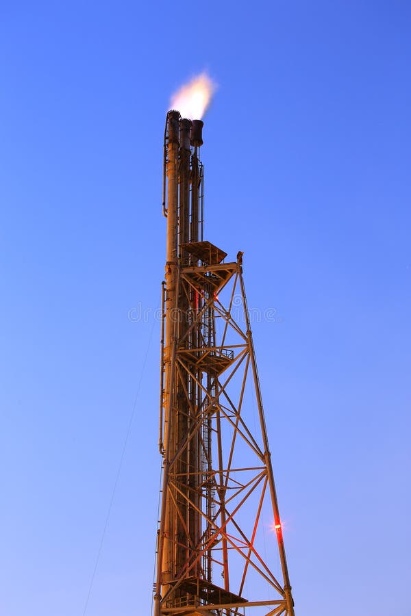 Gas flare at a refinery stock photo. Image of burning - 36775826