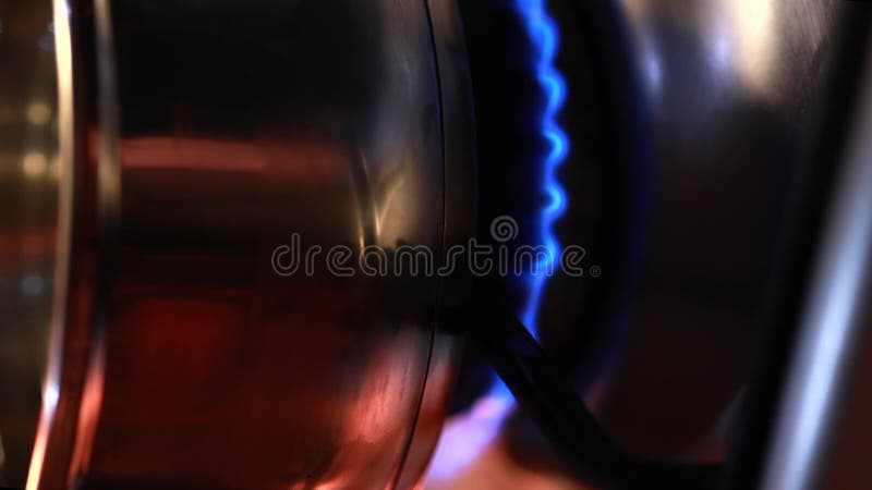 Gas is Ignited in a Burner Under a Metal Pan on the Stove. Igniting a ...