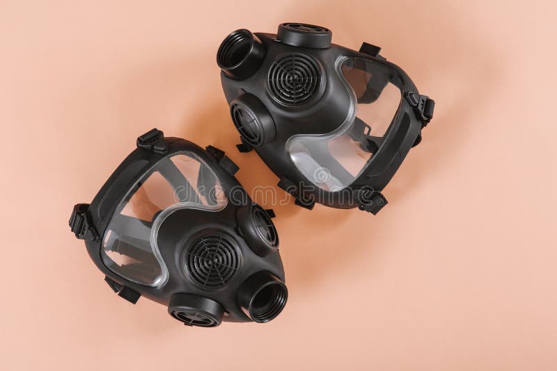 Gas Mask without Filter on Orange Background. Two Respirators Stock ...