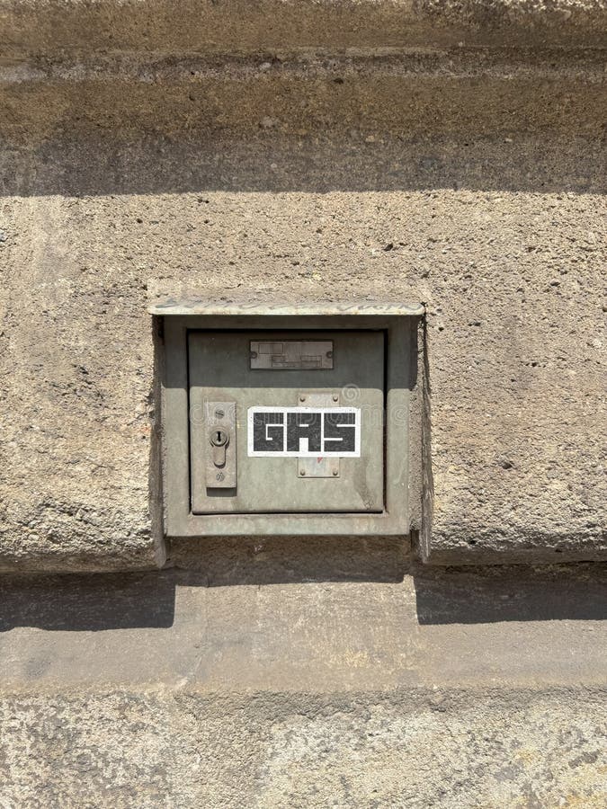 Gas Meter Box on Concrete Wall with Sunlight Illuminating Utility ...