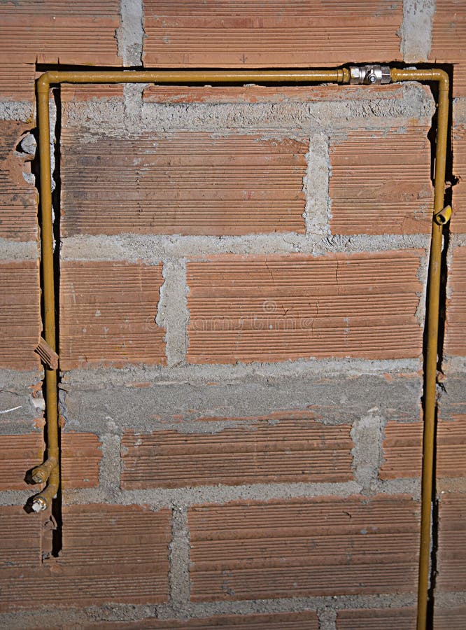 Gas network in the wall stock image. Image of conduits - 144446273