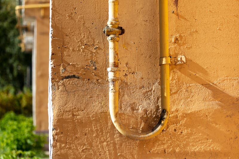 Gas Pipe Hanging on the Wall of a Building Stock Image - Image of ...