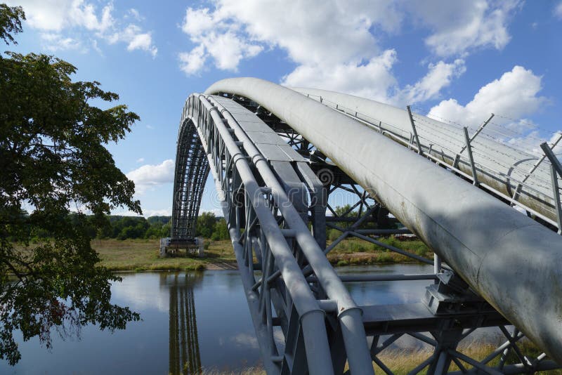 Gas pipe over the river stock image. Image of engineering - 98295055