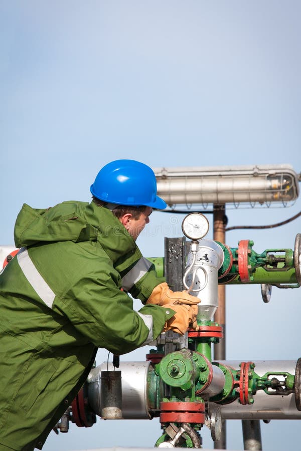 Male and Female Oil-workers Stock Image - Image of factory, pollution ...