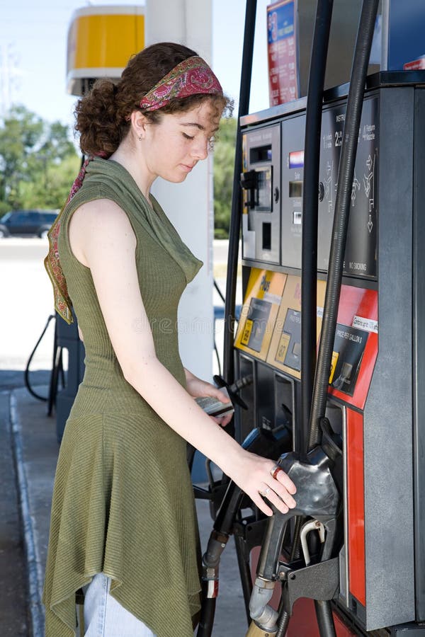 At the Gas Pump stock image. Image of station, female - 6650293