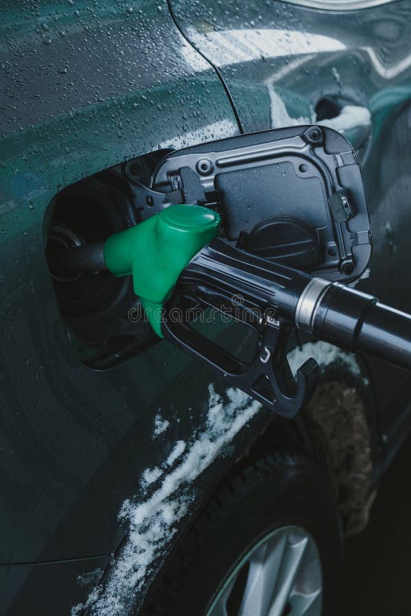 A Gas Pump Nozzle in a Car S Fuel Tank. Stock Image - Image of ...