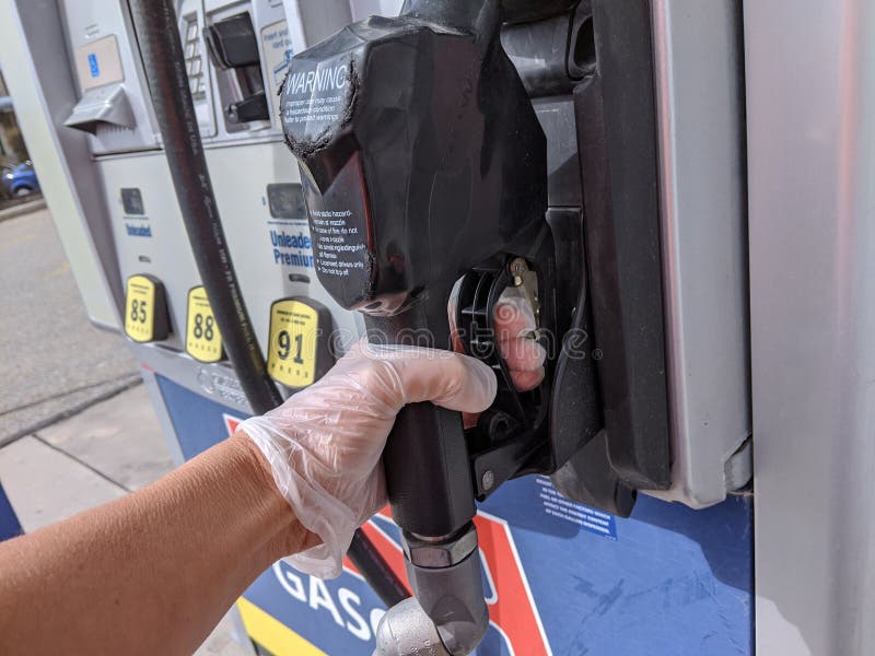 Gas Pumps with Gloves for Protection Editorial Stock Photo - Image of ...
