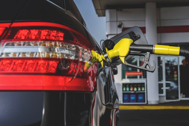 The Gas Station Gun is Inserted into the Gas Tank for Refueling. Close ...