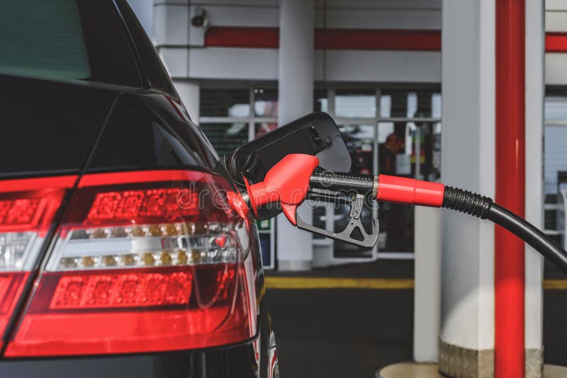 The Gas Station Gun is Inserted into the Gas Tank for Refueling. Close ...