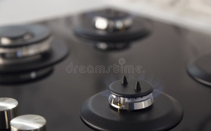 Gas Stove Burner. Modern Kitchen Stove with Blue Flame Burning. Stock ...