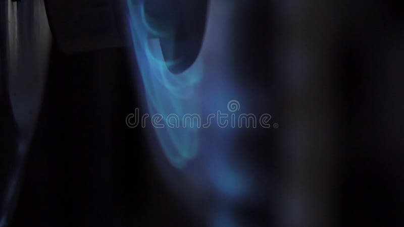 Vertical Screen: Gas Switch on and Lit on the Kitchen Stove Appearing ...