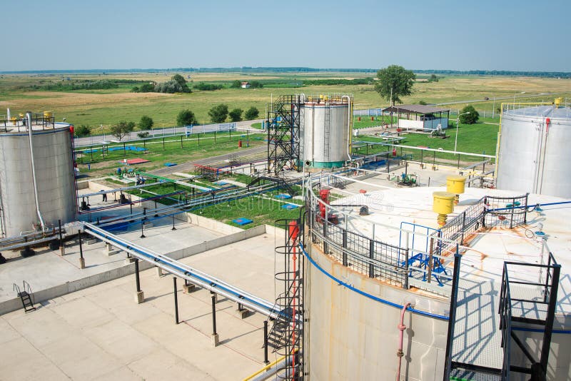 Gas Tank in Oil Processing Plant Stock Photo - Image of ladder, metal ...