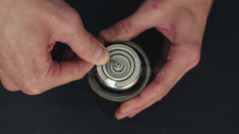 Gas Valve Release: Top-View Man Operating with Screwdriver on Camping ...