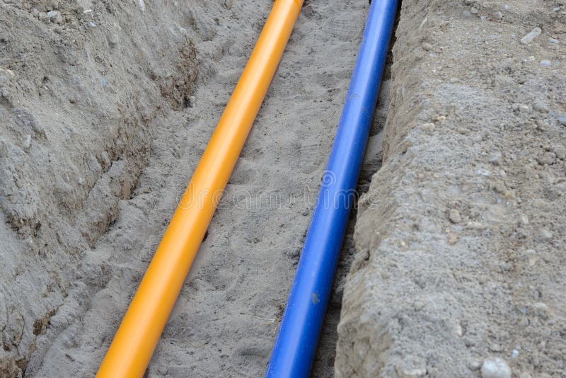 Laying Gas- and Water Pipes Stock Image - Image of cables, operators ...