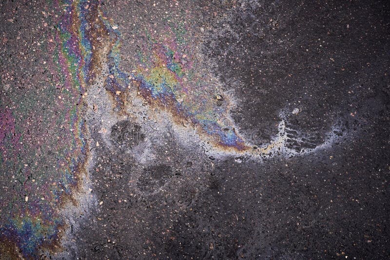 Gasoline or Oil Spill on Asphalt Creating Rainbow Color Pattern. Stock ...