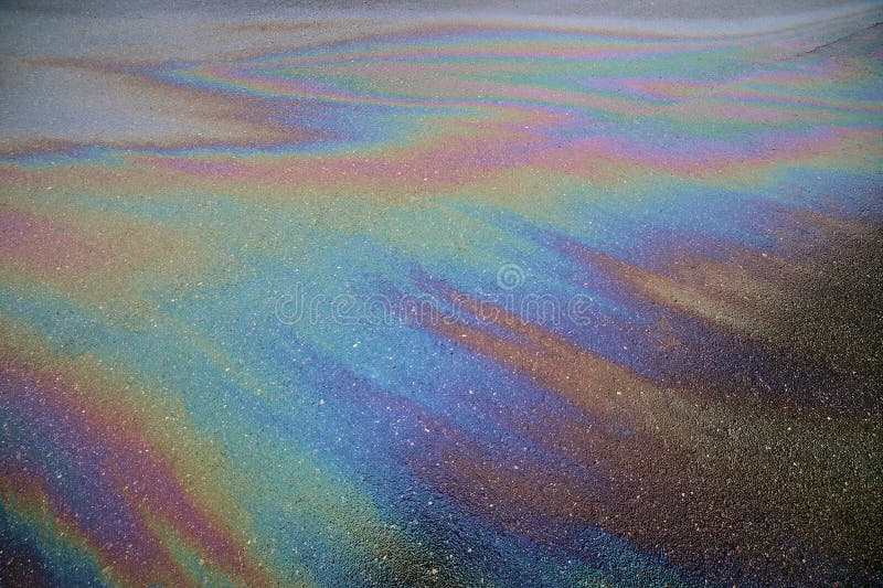 Gasoline Rainbow Creating Colorful Patterns on Asphalt Road. Stock ...