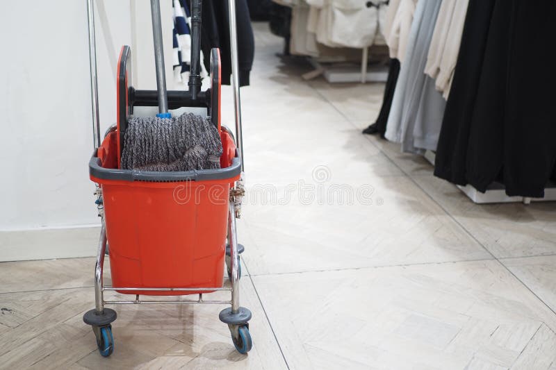 A Gaspowered Cleaning Machine with a Rolling Cart, Broom, and Mop Stock ...