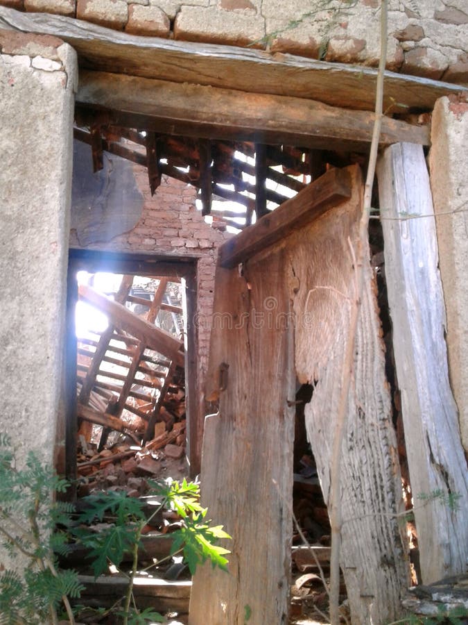 The Dilapidated Gate of the House Made of White Timber Was Closed To ...
