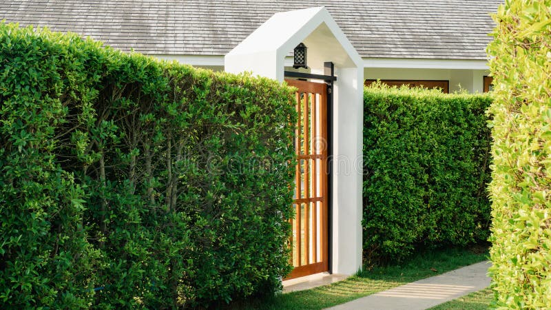 Gate House Garden in a Resort-style Setting, with a Concrete and Grassy ...