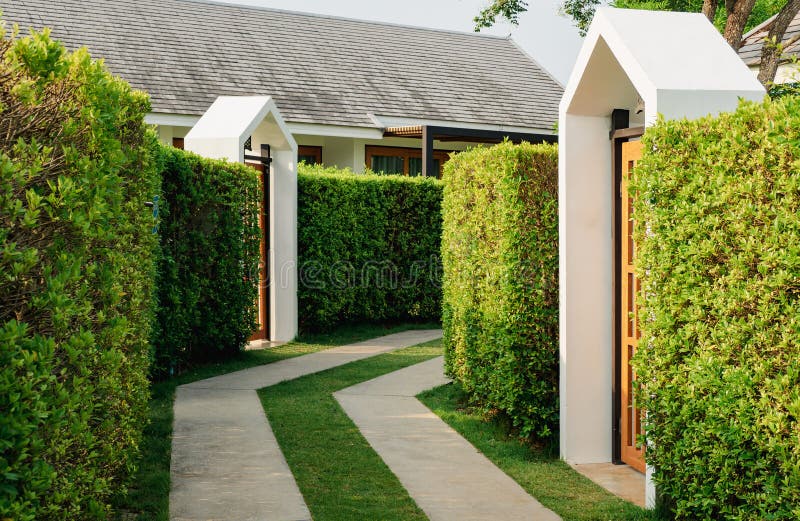 Gate House Garden in a Resort-style Setting, with a Concrete and Grassy ...