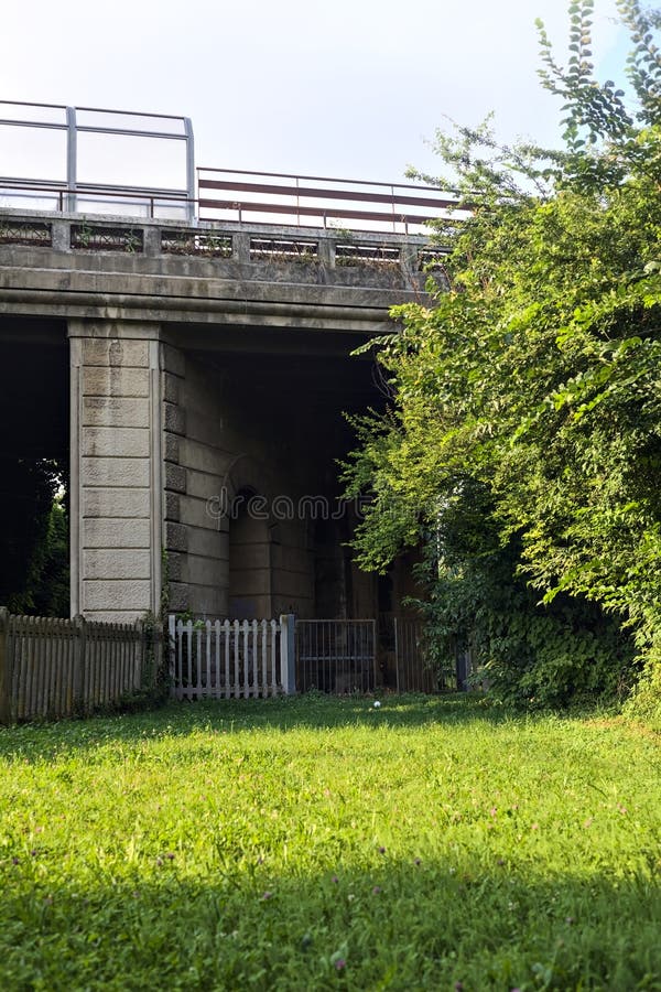 Gate in a Lawn Under a Bridge Next To a Railroad Track in a Park at ...