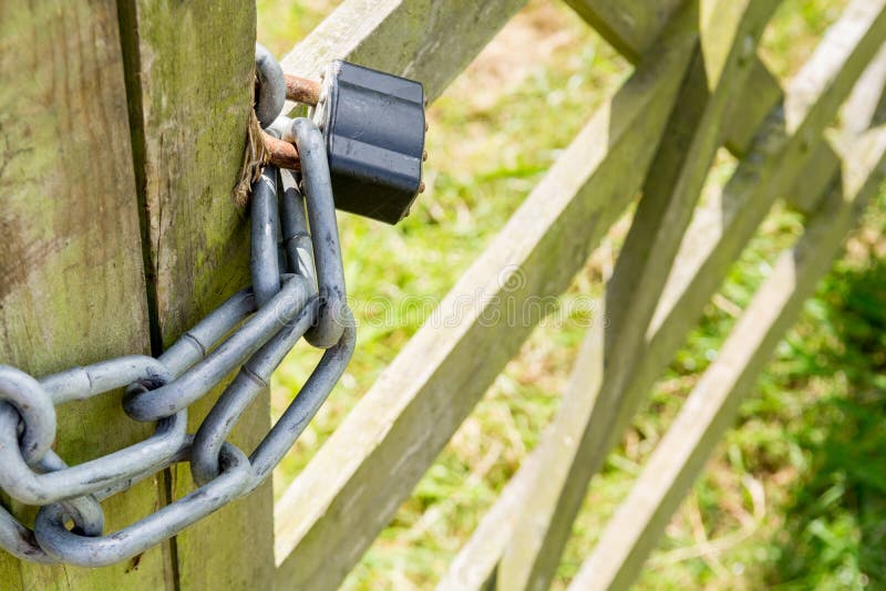 Gate Locked with a Metal Chain and Padlock Stock Image - Image of ...