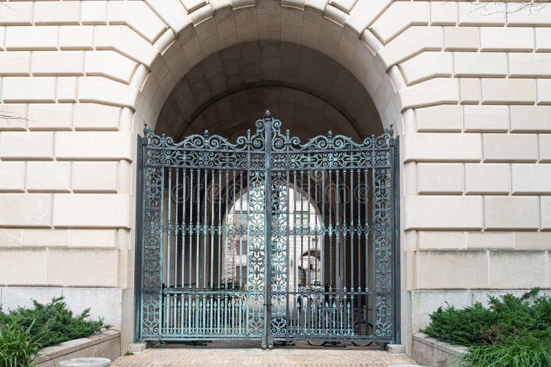 Gate Made of Metal Rods in an Arch of a Stone Wall Stock Image - Image ...