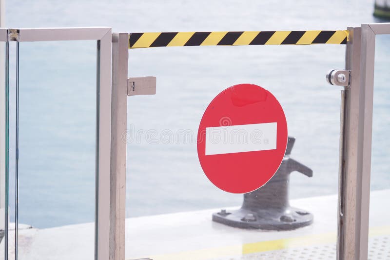 Gate with No Entry Sign Near Harbor in Bright Daylight Stock Image ...