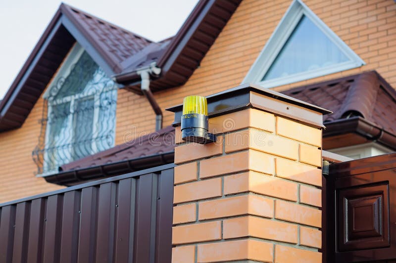 Gate Opening Sensor for a Car on a Brick Post. Entrance To the Yard of ...