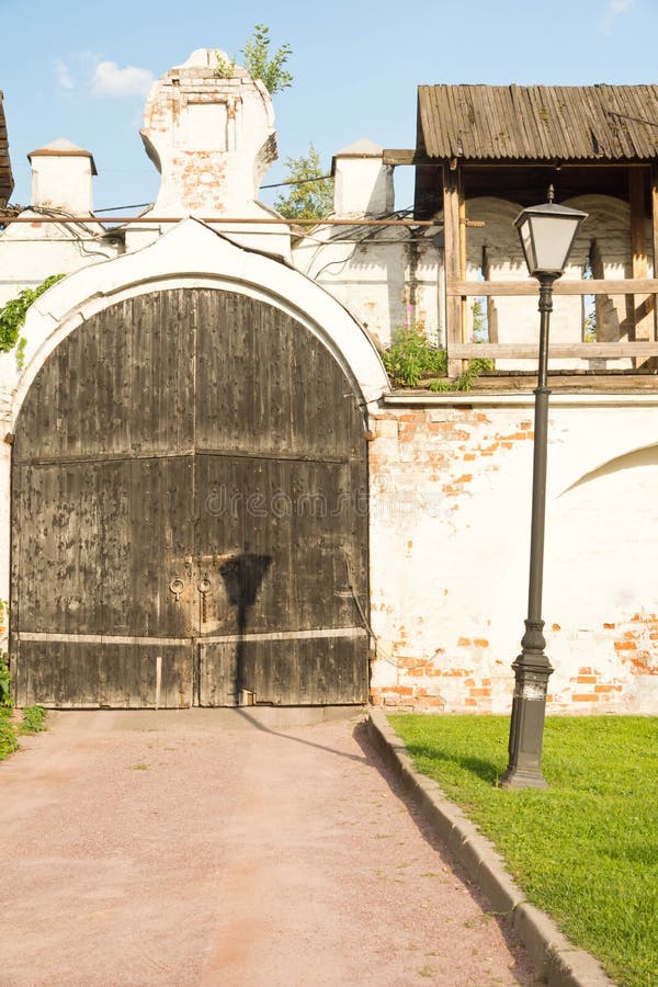 Gate in Park of Ancient Monastery Stock Photo - Image of shrub ...