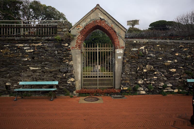 Gate in a stone wall stock image. Image of blue, building - 359365771