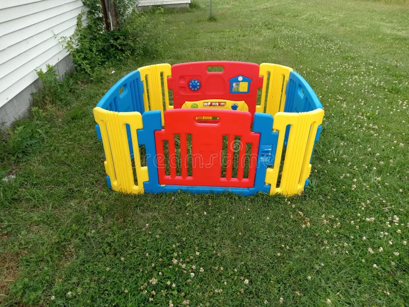 Gate with Swinging Door and Toys Stock Photo - Image of park, grass ...