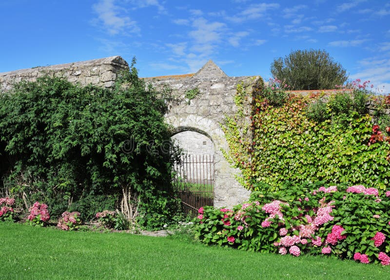 Gated Arch through a Medieval Garden Wall Stock Image - Image of ...