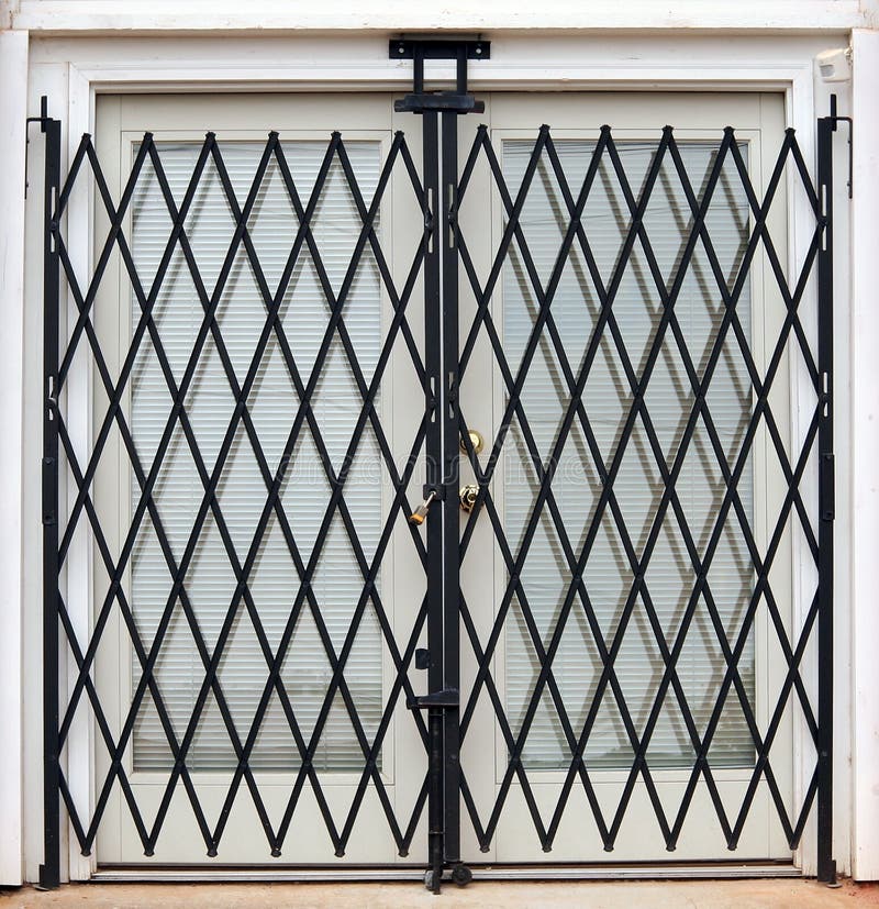 Gated French doors stock image. Image of daytime, double - 1371863
