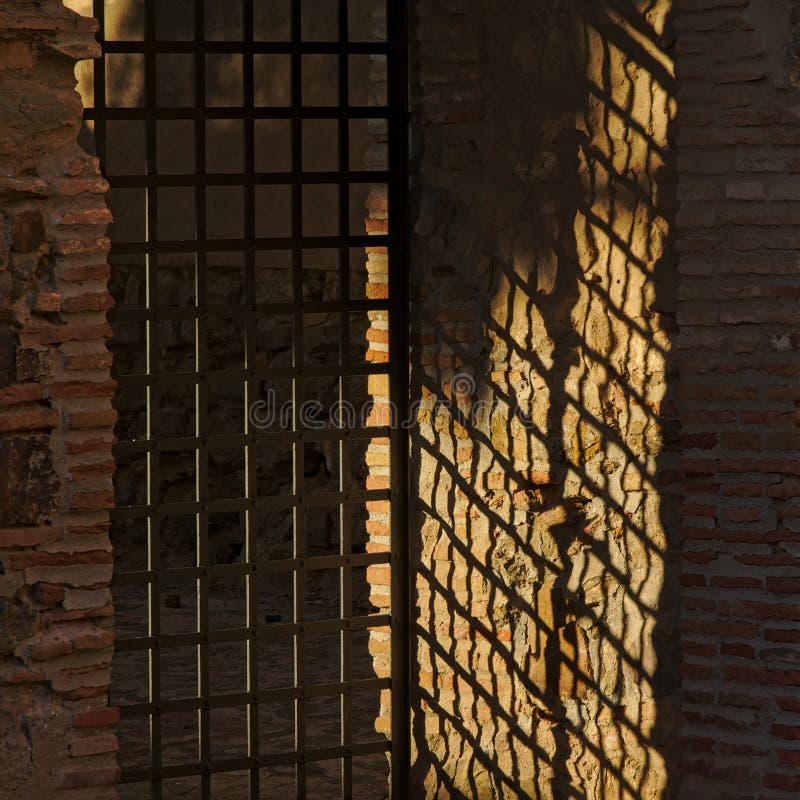 Gates with Bars and Their Shadows on Te Wall Stock Image - Image of ...