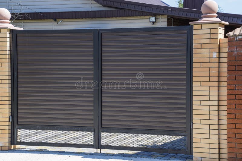Gates of Brown Metal Sheets. Roofing Materials. Stock Photo - Image of ...