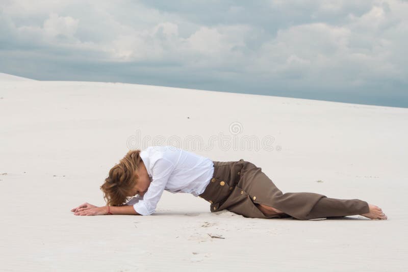 A Gaunt Girl Fell in the Desert Stock Photo - Image of solitude, sand ...