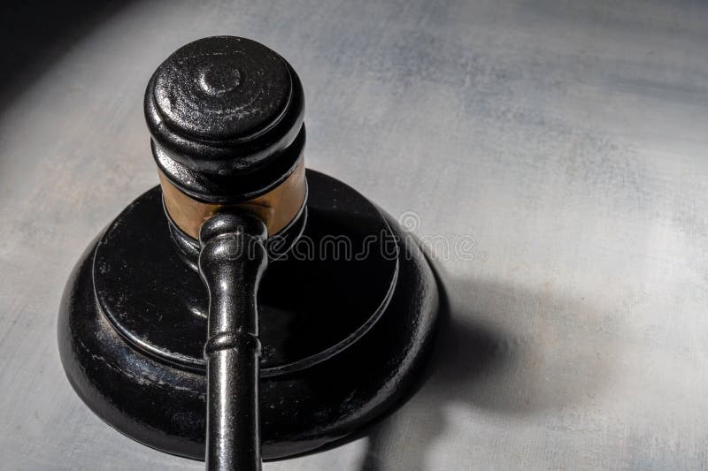 A Gavel on a Surface Illuminated by a Single Light Source, Casting a ...