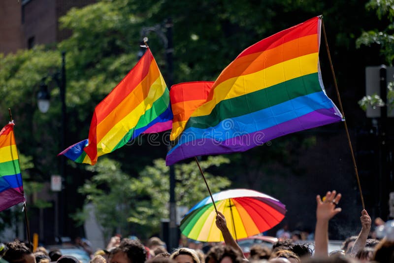Gay Rainbow Flags Waving Above Blurred Crowd Editorial Image - Image of ...