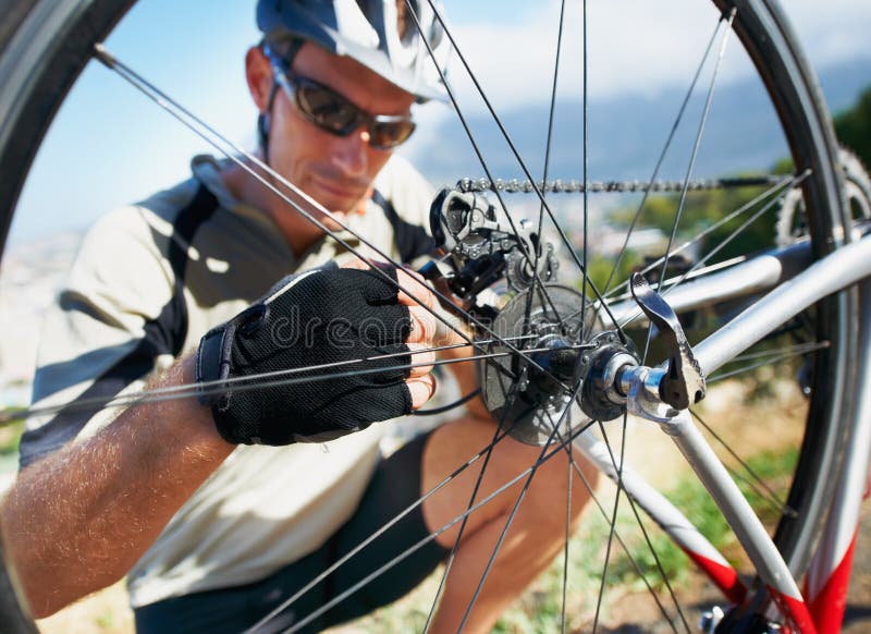 Gear Check. Shot of a Cyclist Checking the Gears on His Bike. Stock ...