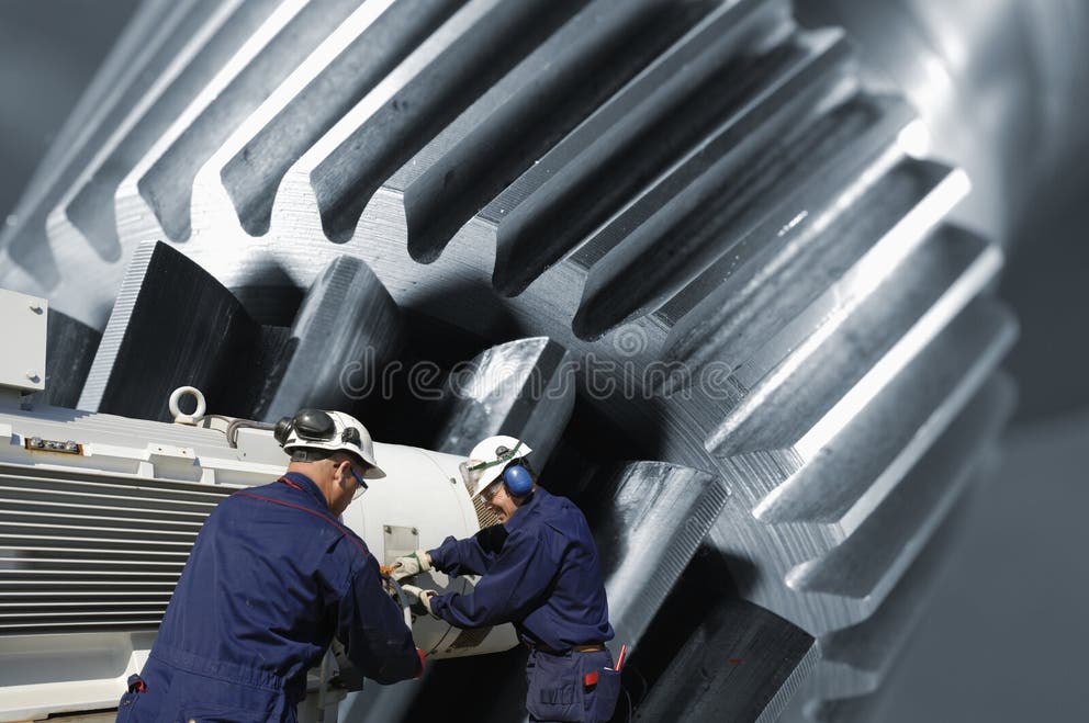 Gear machinery and workers stock photo. Image of connection - 16186196