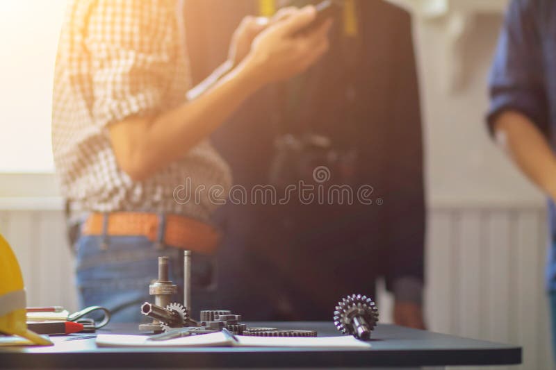 The Gear Set is Placed on the Workbench of a Team of Factory Mechanical ...
