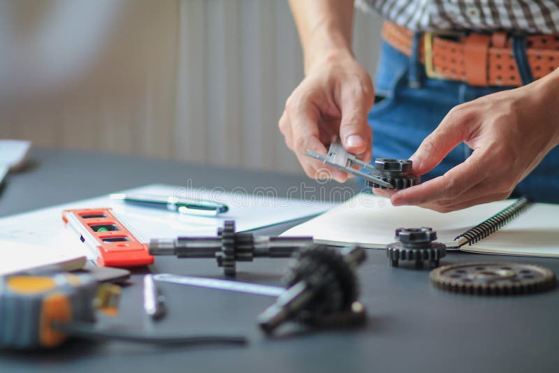 The Gear Set is Placed on the Workbench of a Team of Factory Mechanical ...